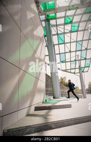 Portrait of businessman running for emergency Stock Photo - Alamy