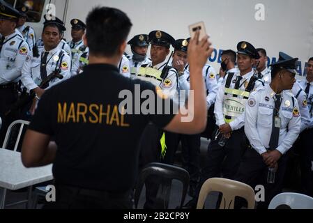 Security guards gather outside V shopping mall. Police surrounded a ...