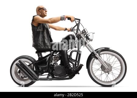 Bald male biker with a chopper motorbike holding a helmet isolated on ...