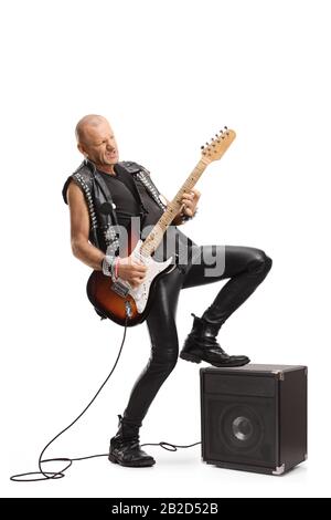 Studio shot of a punk rock guitarist playing guitar and making rock ...