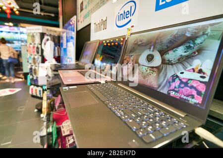sale of modern laptops in electronics stores. exhibition hall of ...