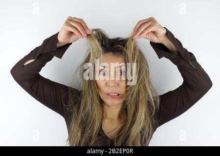 Long Messy Hair Tangle Problem And Damage Stock Photo - Alamy