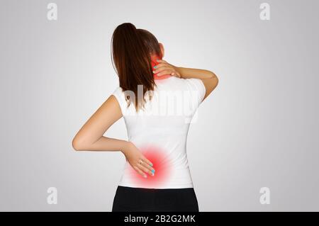 Backache, pain back, loin. Red spot on spine close up. High quality ...