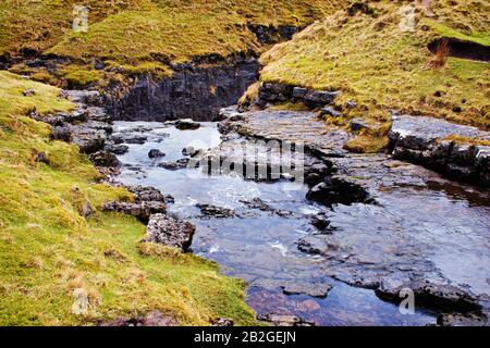 Water flowing over the edge of Hull Pot, Pen-y-Ghent, Yorkshire Dales ...