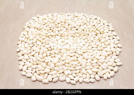 Dry lima beans. On a stone background, top view Stock Photo - Alamy
