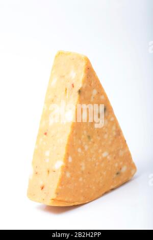 A wedge of Cheddar Mexicana cheese bought from a Waitose supermarket ...