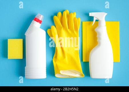 Set of cleaning supplies and spray bottle on grey background Stock ...