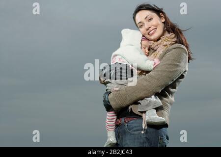 Low angle view of girl sleeping on tree trunk in forest Stock Photo - Alamy