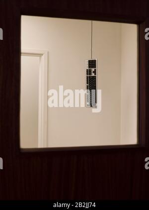 Keyboard hanging from ceiling Stock Photo - Alamy