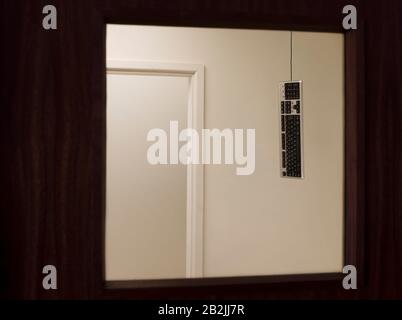 Keyboard hanging from ceiling Stock Photo - Alamy