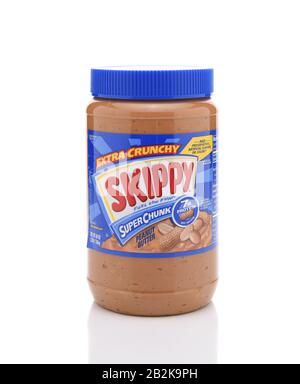 IRVINE, CALIFORNIA - JULY 10, 2017: Two Barqs Root Beer Cans on a bed ...