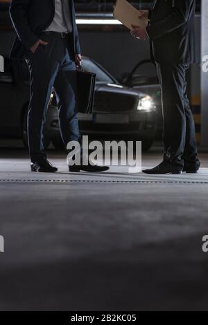 Two businessmen conducting suspicious business Stock Photo - Alamy