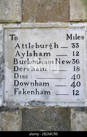 Ornate stone road sign, Holt town, Norfolk, England, UK Stock Photo - Alamy