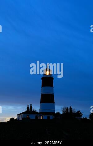 Sunset over Happisburgh Lighthouse, Happisburgh village, North Norfolk ...