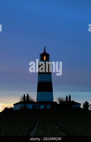 Sunset over Happisburgh Lighthouse, Happisburgh village, North Norfolk ...