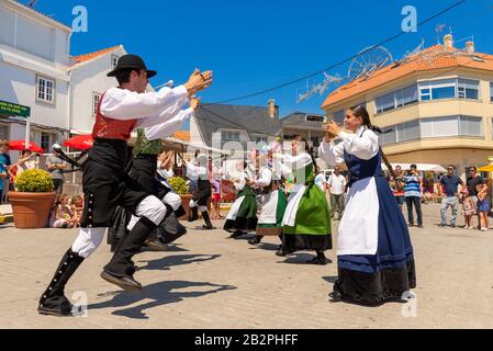 Traditional Galician dancing at a summer festival in the village of ...