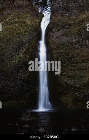 A wide shot of two rocks on Wied Babu river in the Blue Grotto, Zurrieq ...