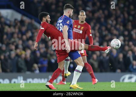 Olivier Giroud of Chelsea holding off Joe Gomez of Liverpool during the ...