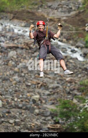 Adult Man Zip Line Adventure In Ecuadorian Rainforest Stock Photo - Alamy