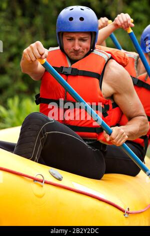 Group Of Young Athletes Training For Whitewater Rafting Stock Photo - Alamy