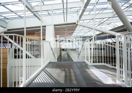 White modern ceiling bridge inside clean subway with spotlights and ...