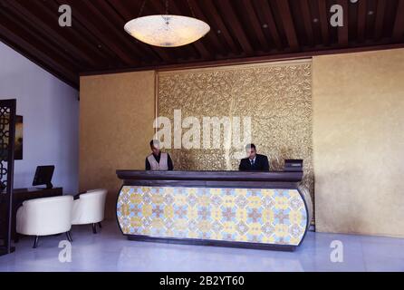 5 Star hotel. Reception desk with service bell and picturesque ...