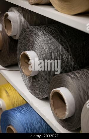 Cotton sewing threaded reels in a sewing shop Stock Photo - Alamy