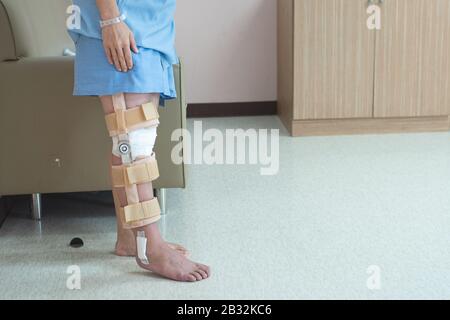 Leg of pcl ligament knee surgery patient lying on bed in ward at ...