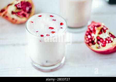Traditional indian lassi - cold yougurt drink on white table with ...
