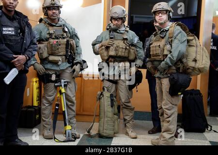 Member of U.S. Secret Service HAMMER team wait outside the room while ...