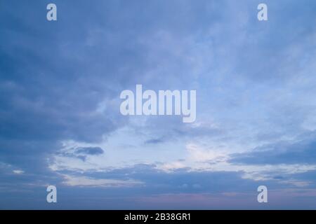 Beautiful sky with stretched clouds during twilight Stock Photo - Alamy