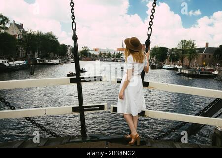woman on bridge overlooking city Stock Photo - Alamy