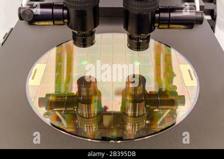 Silicon wafer on machine process examining in microscope Stock Photo ...