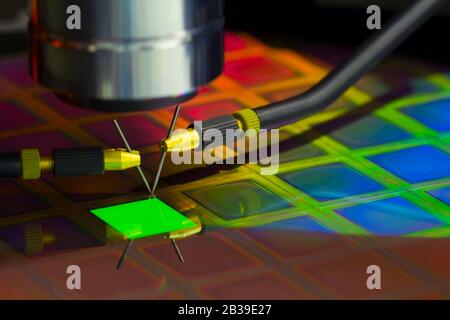 Close up of examining a sample of OLED display with probe station under ...