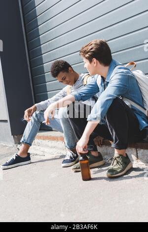 Friends smoking cigarettes together Stock Photo - Alamy