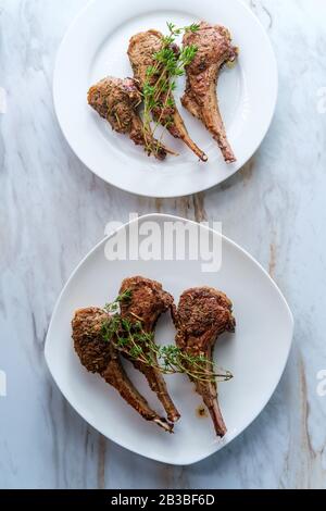 Fancy and simple marinated French lamb rib with thyme garnish Stock ...
