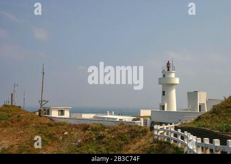 Sunny view of the beautiful Bitoujiao Lighthouse at New Taipei City ...