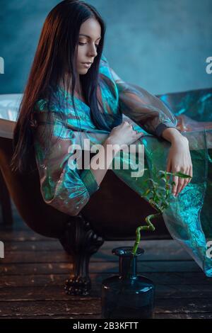 A woman looks like a sad little mermaid from a fairy tale. Beautiful ...