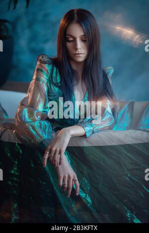A woman looks like a sad little mermaid from a fairy tale. Beautiful ...