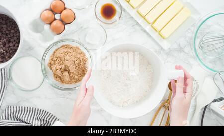 Step by step. Flat lay. Mixing food coloring into the meringue to bake ...