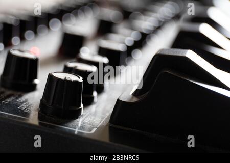 Knobs on a control panel for special sound effects Stock Photo - Alamy