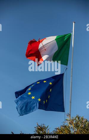 Flags of Italy and of the European Union at Lake Como, Italian Alps ...
