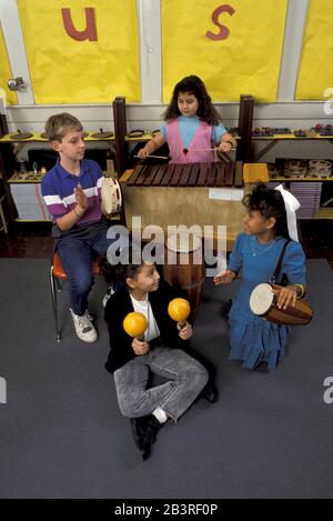 School children playing musical instruments in band Stock Photo - Alamy
