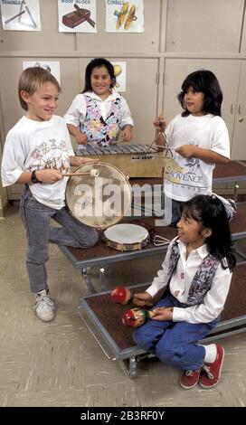 School children playing musical instruments in band Stock Photo - Alamy