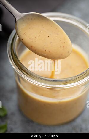 Honey and mustard yellow creamy sauce dip Stock Photo - Alamy