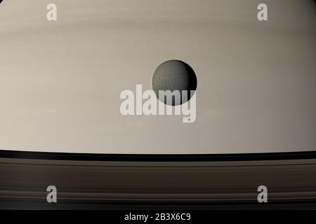 Epimetheus orbiting around Saturn planet. 3d render Stock Photo - Alamy