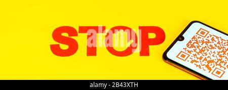 STOP Sign with red colorful QR Code on smart phone screen for ...