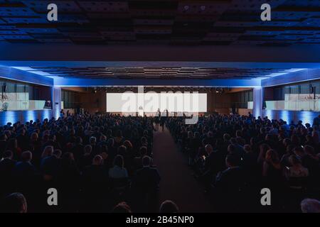 Conference hall full of audience and speakers on the stage Stock Photo ...