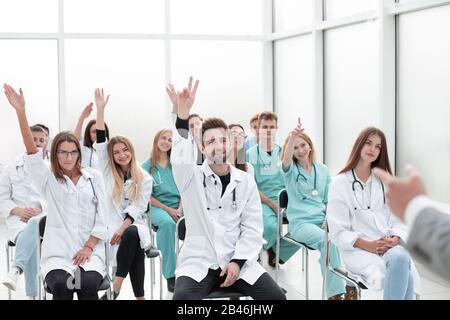 top view. a group of smiling doctors pointing at you Stock Photo - Alamy