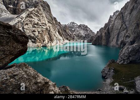 A beautiful landscape of green mountains and a lake in Fussen, Germany ...